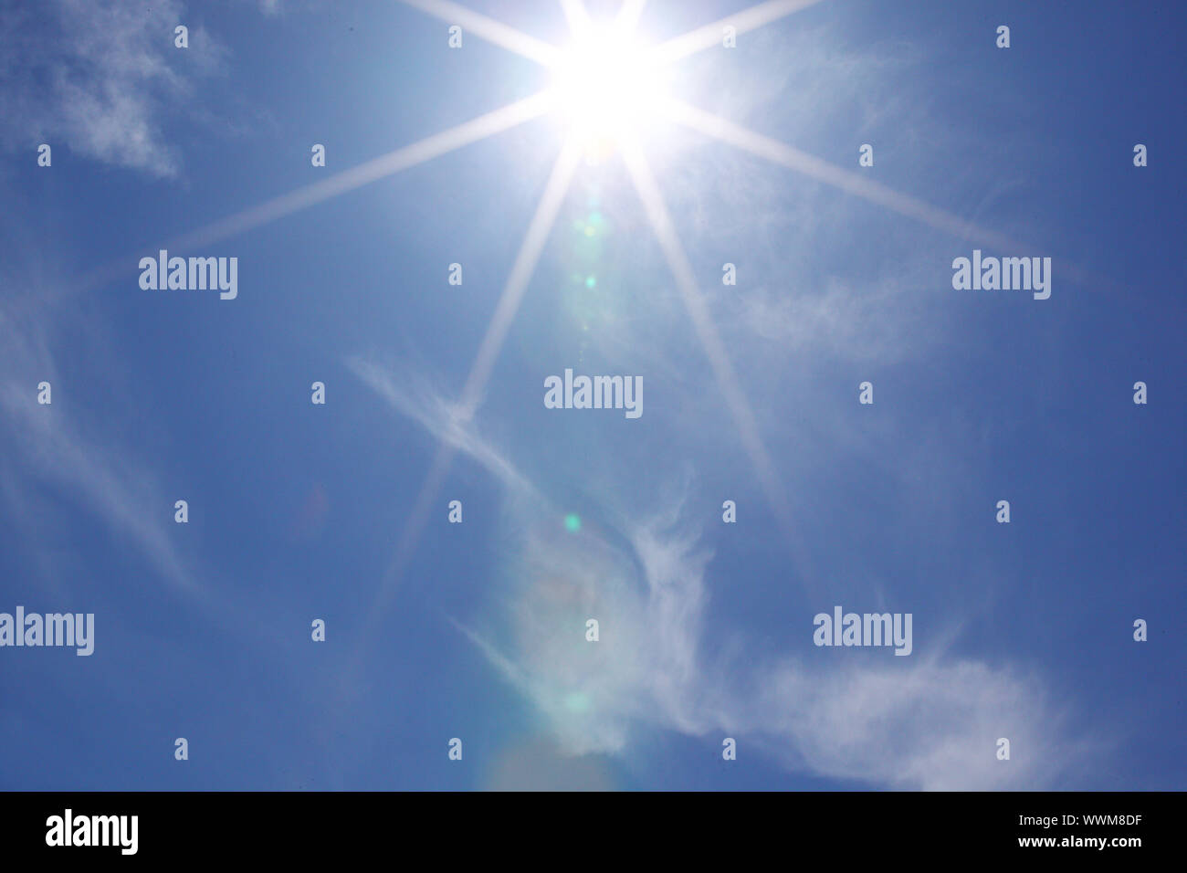 sun in blue day sky Stock Photo - Alamy