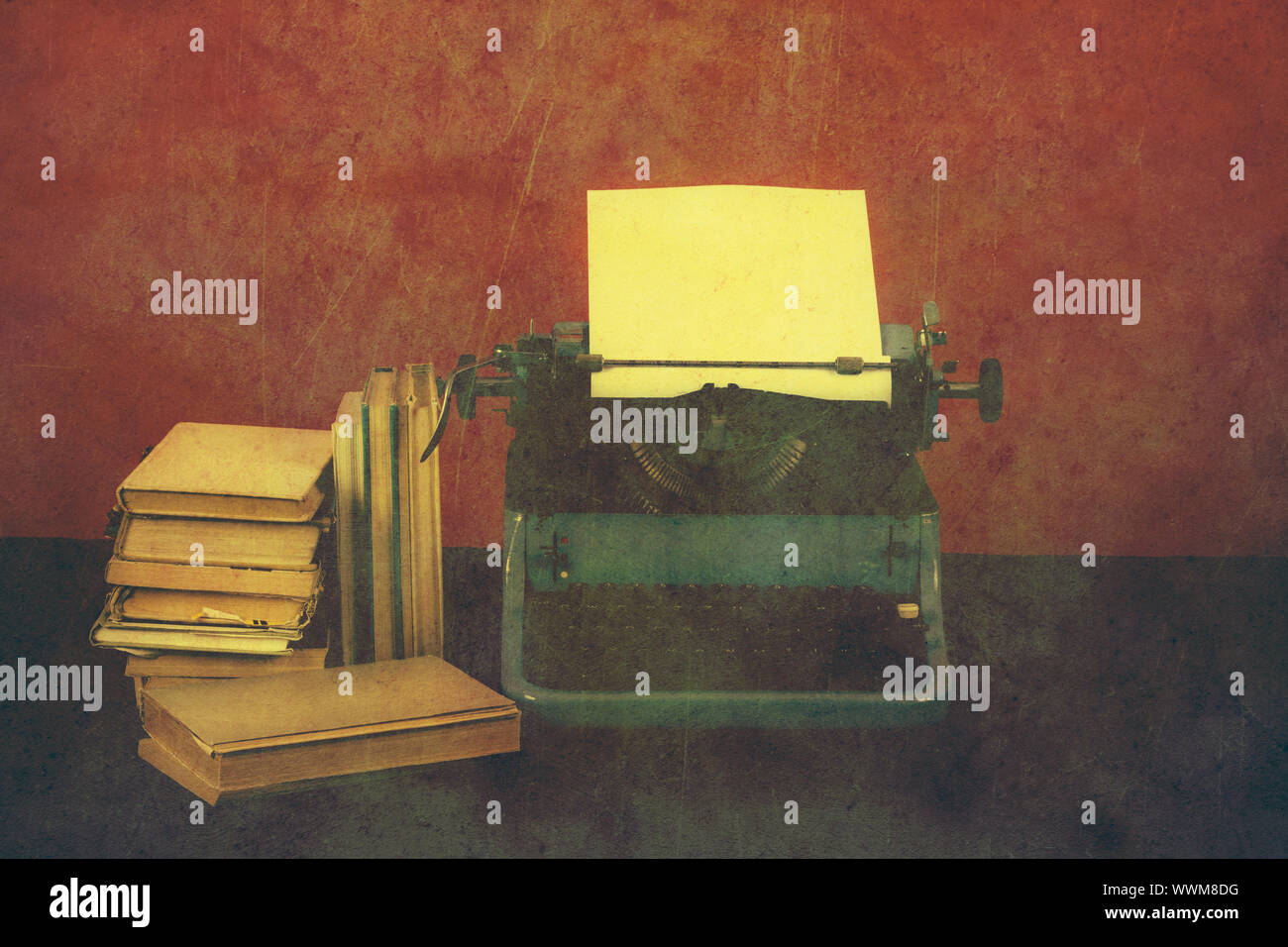 Old typewriter with books retro colors on the desk Stock Photo - Alamy
