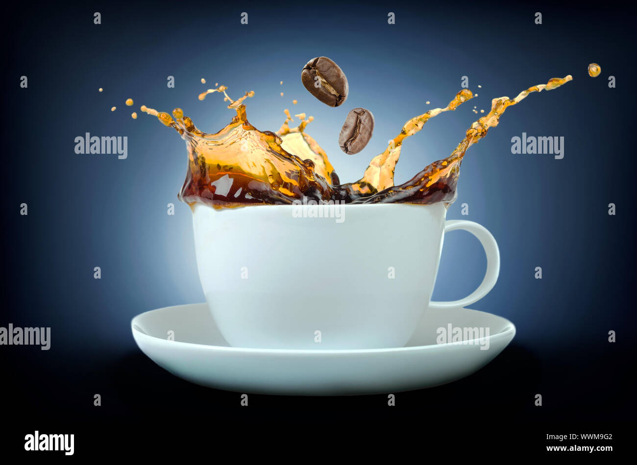 Coffee splash with beans Stock Photo - Alamy