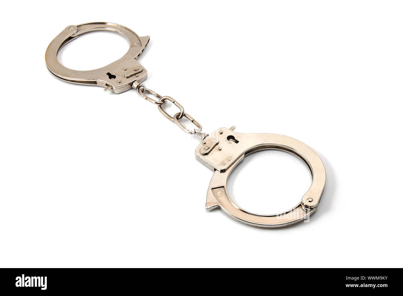 police handcuffs isolated on a white background Stock Photo - Alamy