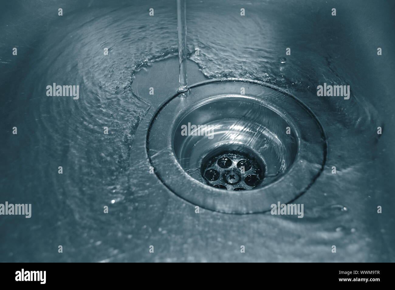 water flow into the drain in the kitchen Stock Photo - Alamy