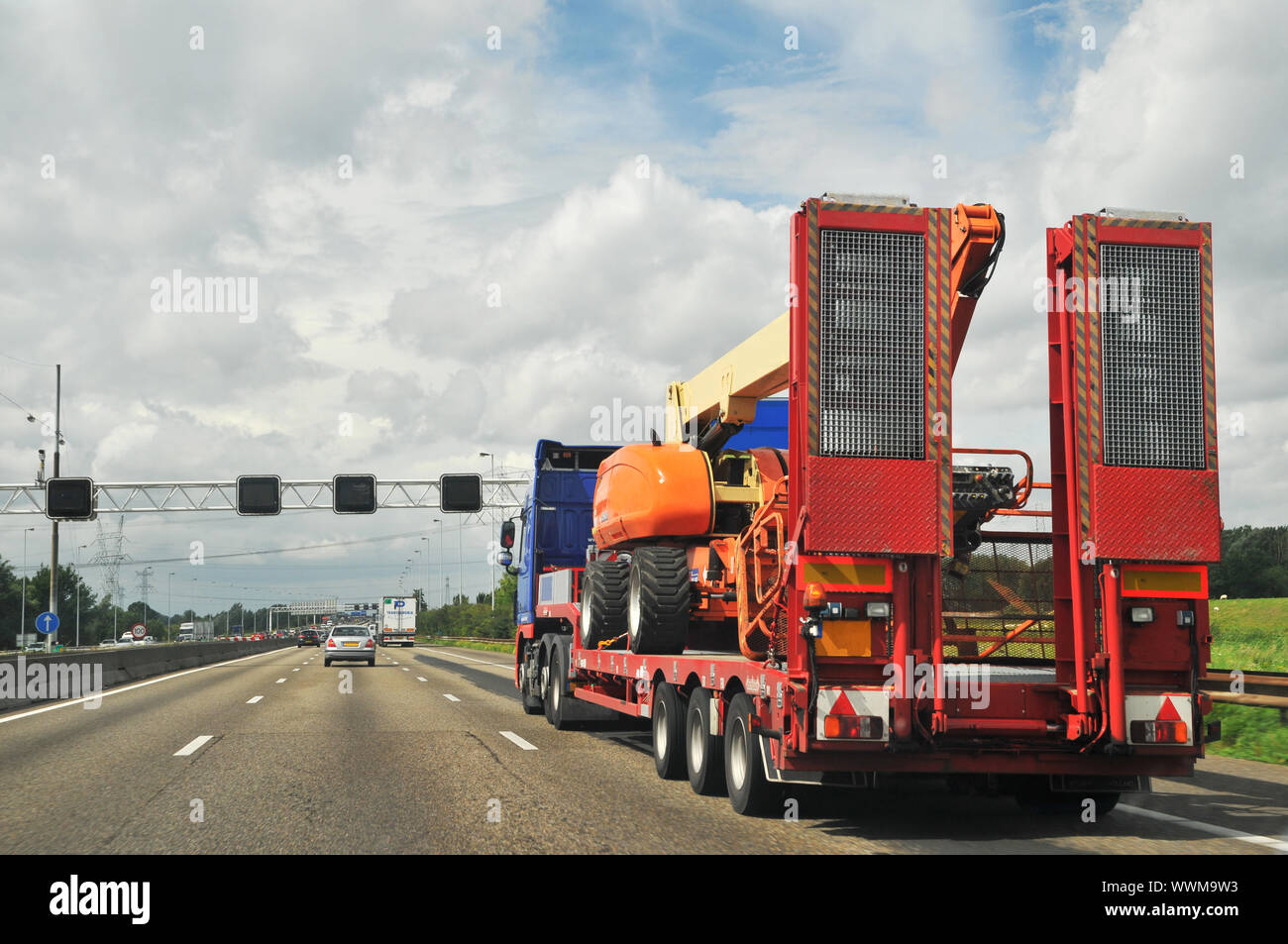 Heavy transport with trailer at the highway Stock Photo - Alamy