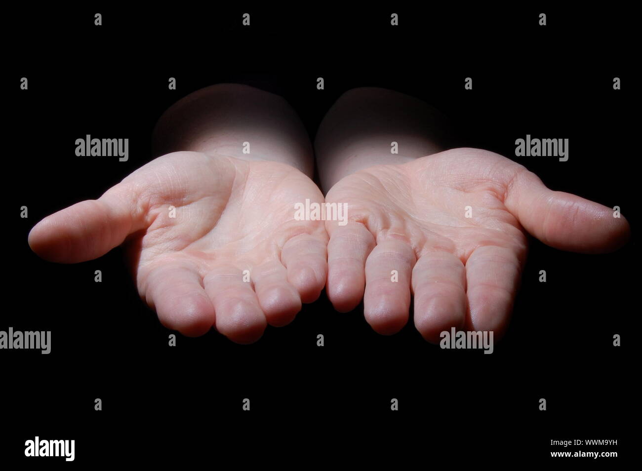empty hands isolated on a black background Stock Photo - Alamy