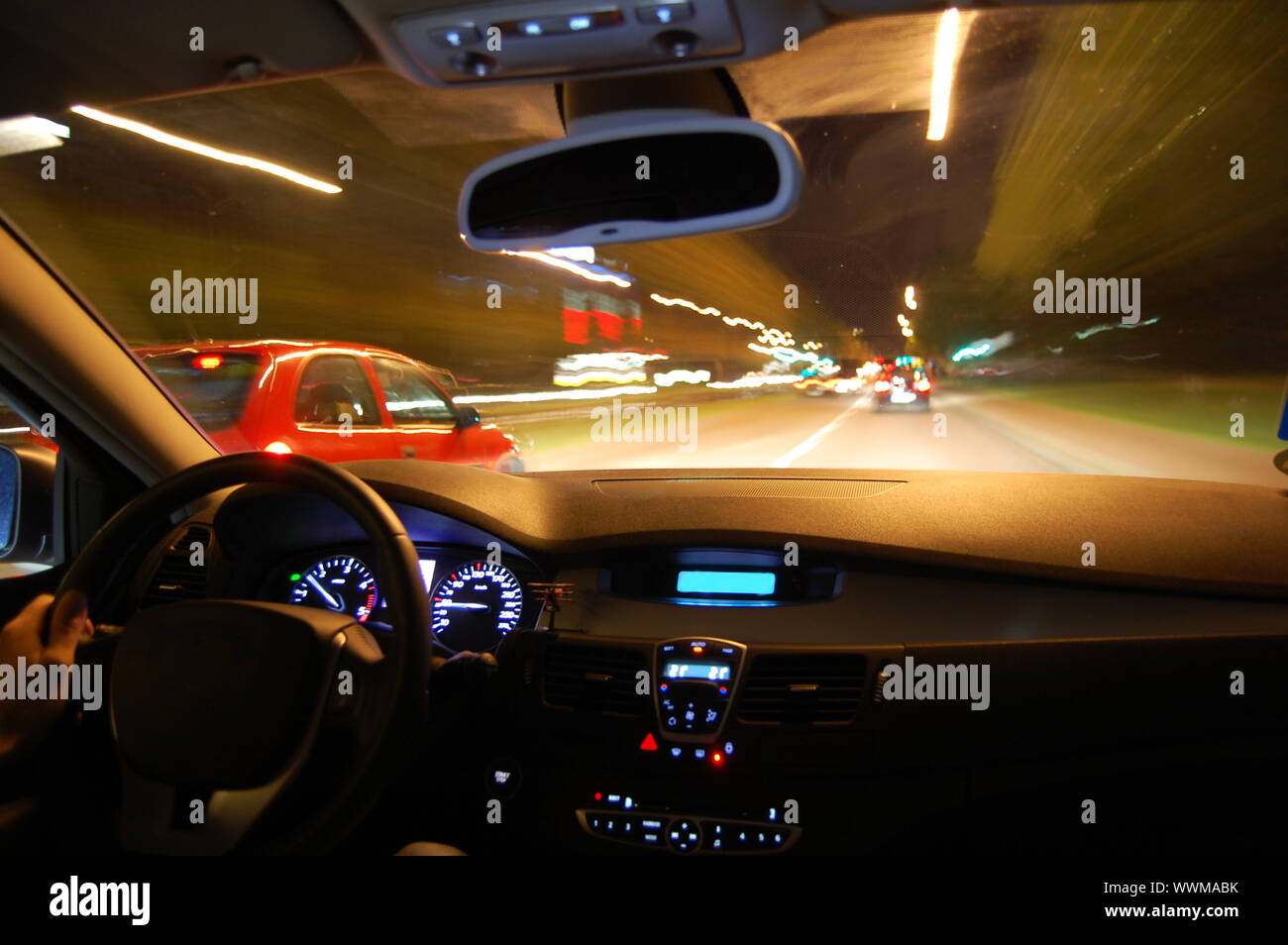 night drive with car in motion through the city shows the speed Stock ...