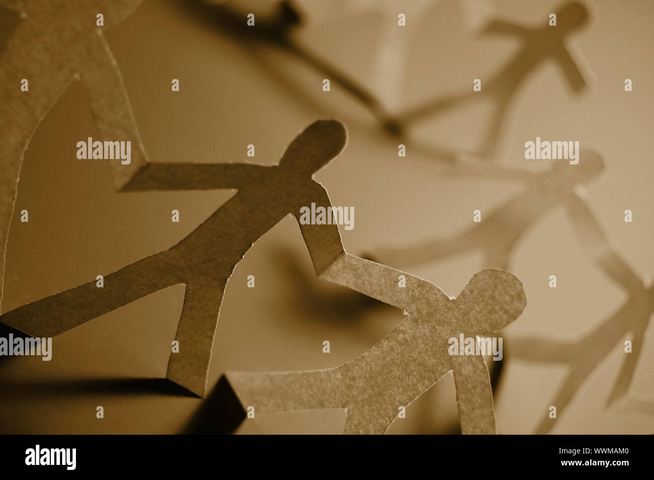 paper people doing teamwork in their business Stock Photo - Alamy