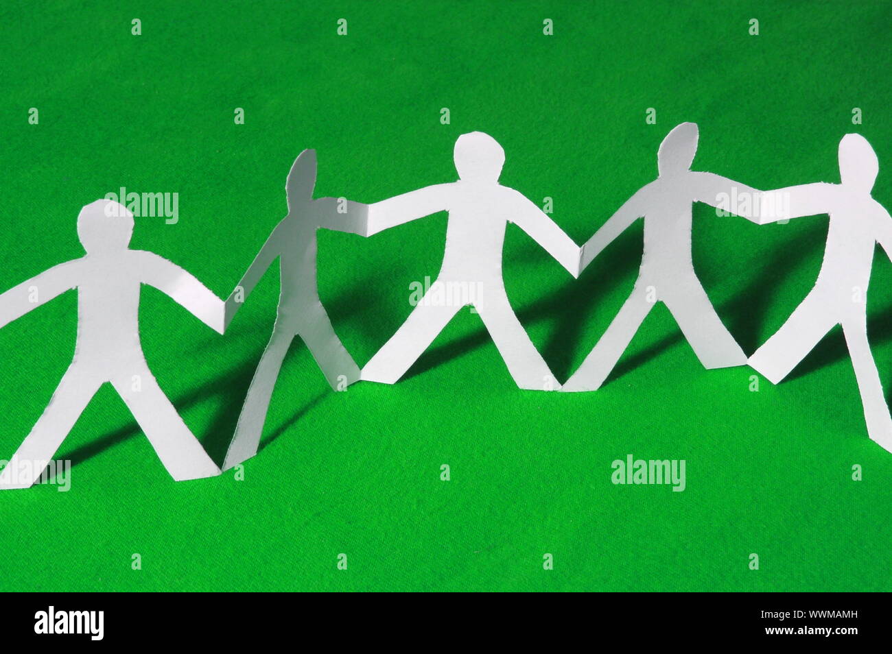 paper people doing teamwork in their business Stock Photo - Alamy