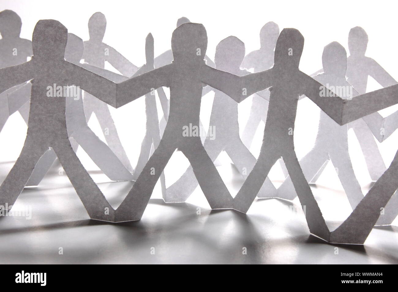 paper people doing teamwork in their business Stock Photo - Alamy