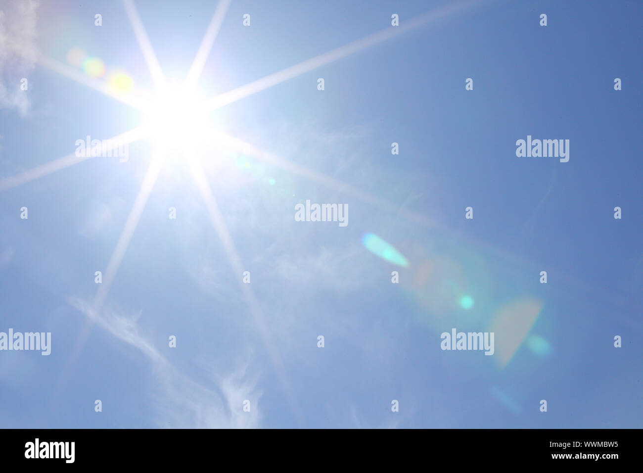 sun in blue day sky Stock Photo - Alamy