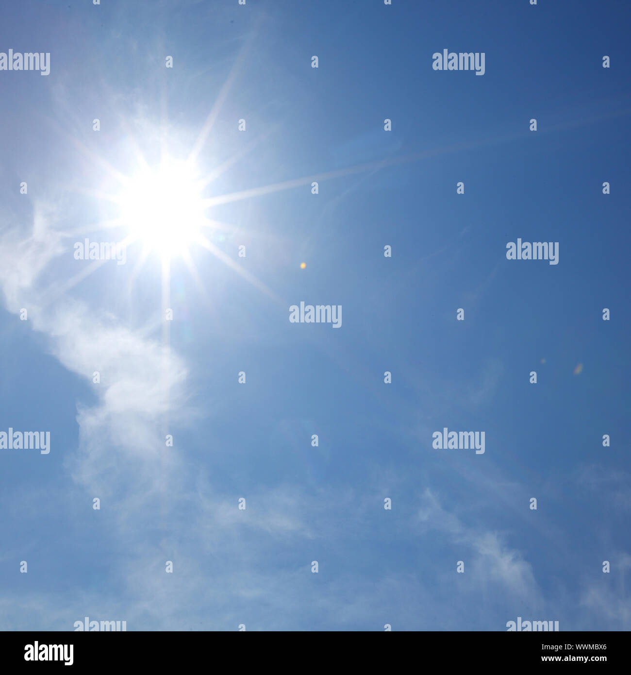 sun in blue day sky Stock Photo - Alamy