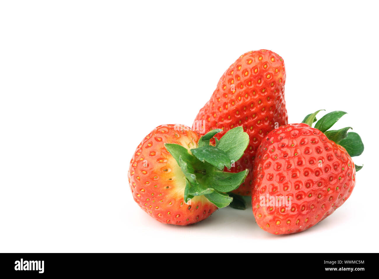 strawberry pile on white background Stock Photo - Alamy