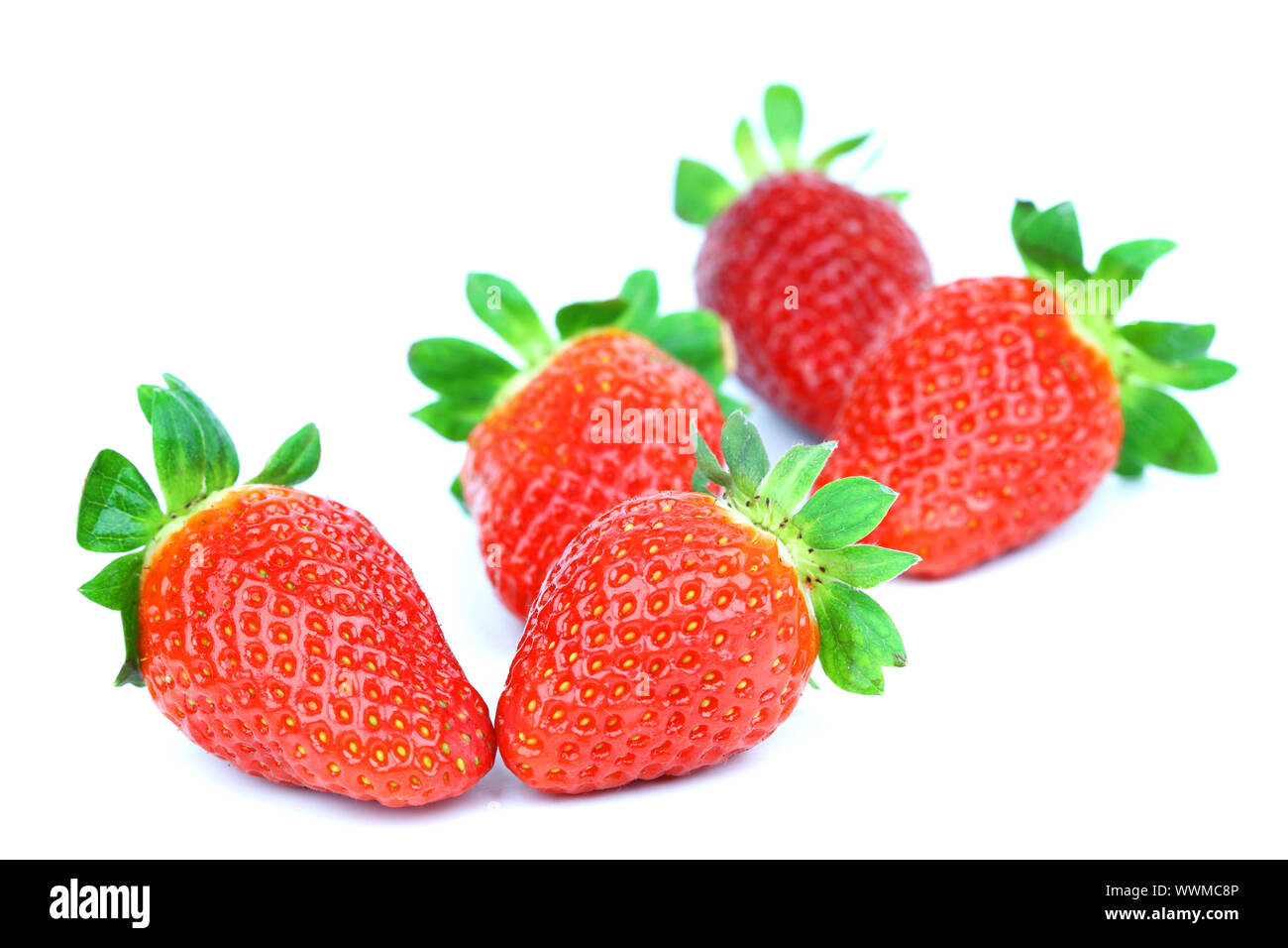 strawberry pile isolated on white background Stock Photo - Alamy