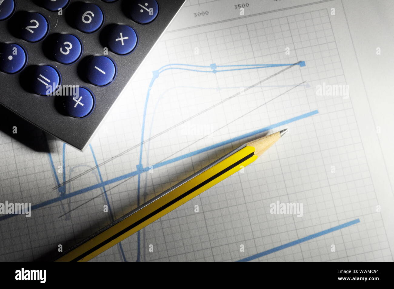 financial business graph with pen and calculator Stock Photo - Alamy