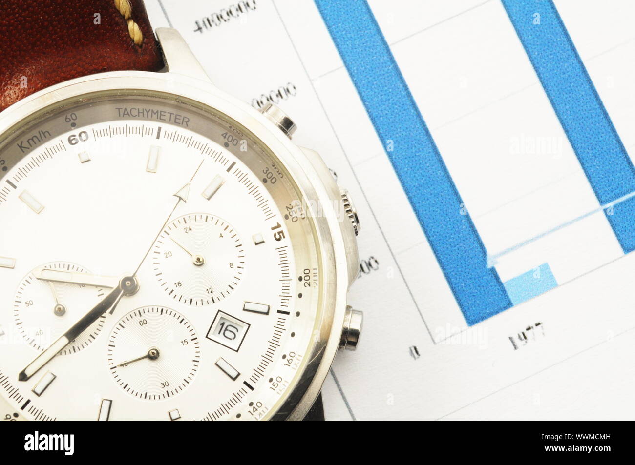 watch and business chart showing time concept Stock Photo - Alamy