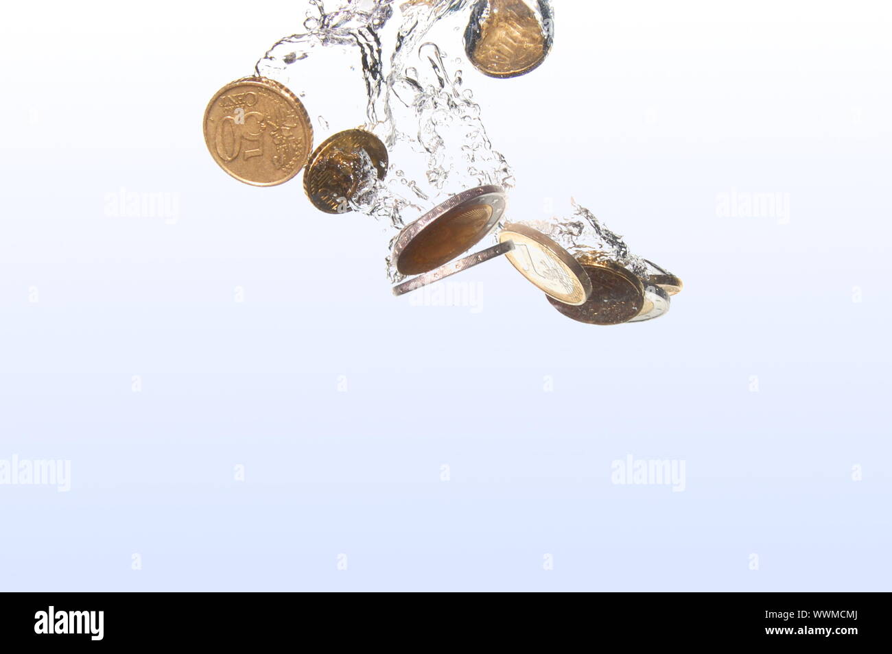 money in water with bubbles on white background Stock Photo - Alamy