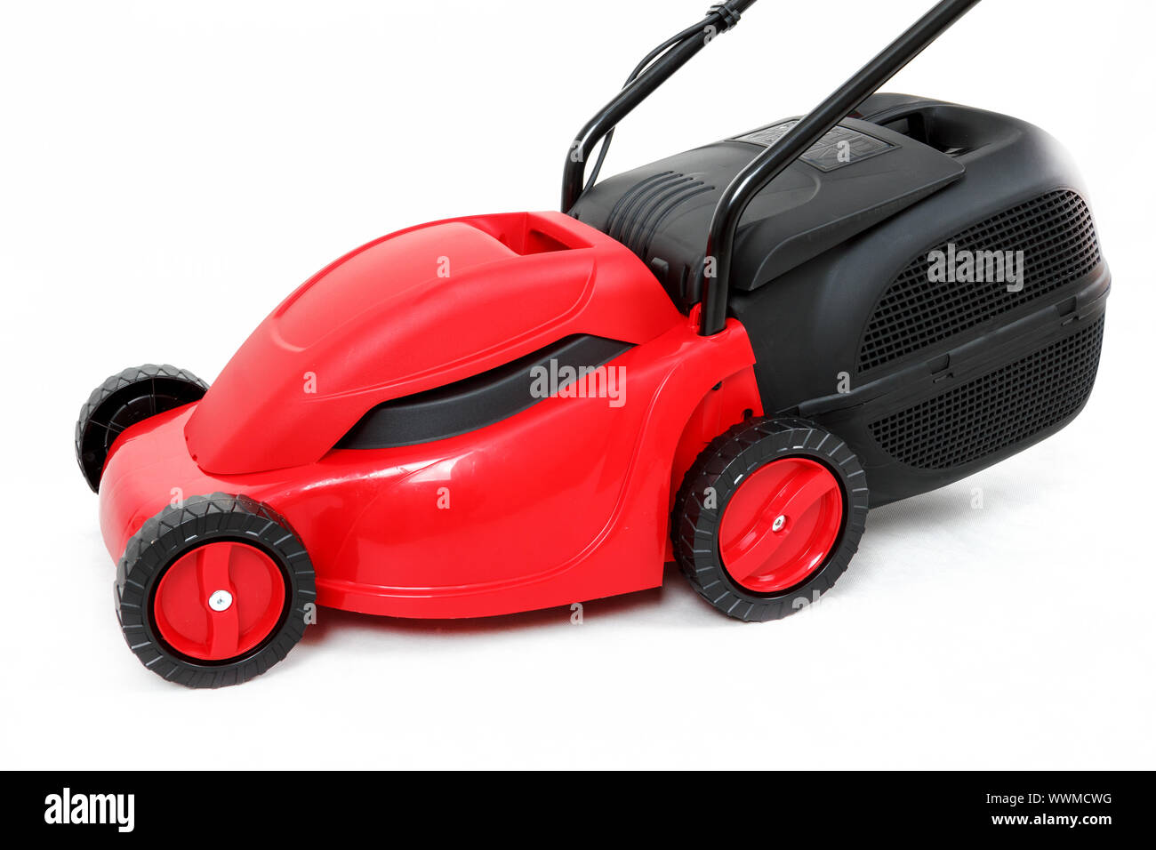 new red lawnmower on white background Stock Photo - Alamy