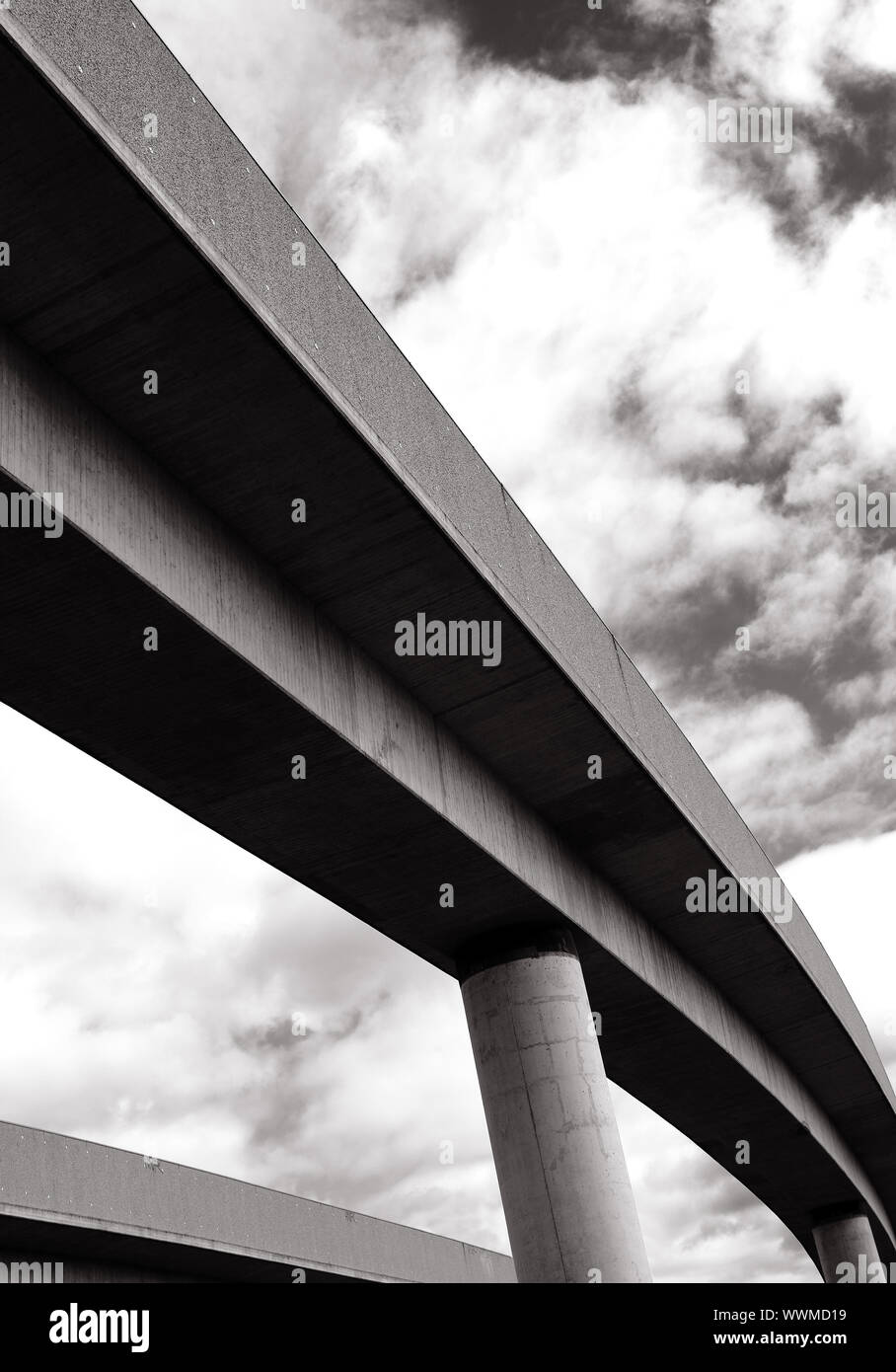 Concrete Railroad bridge towards cloudy sky Stock Photo - Alamy