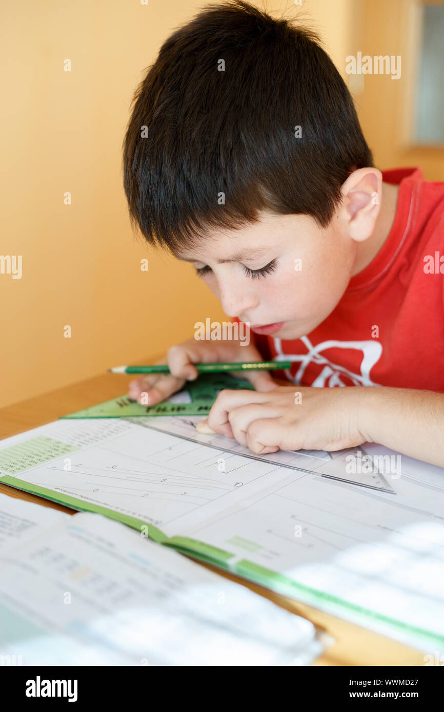 boy doing school homework Stock Photo - Alamy