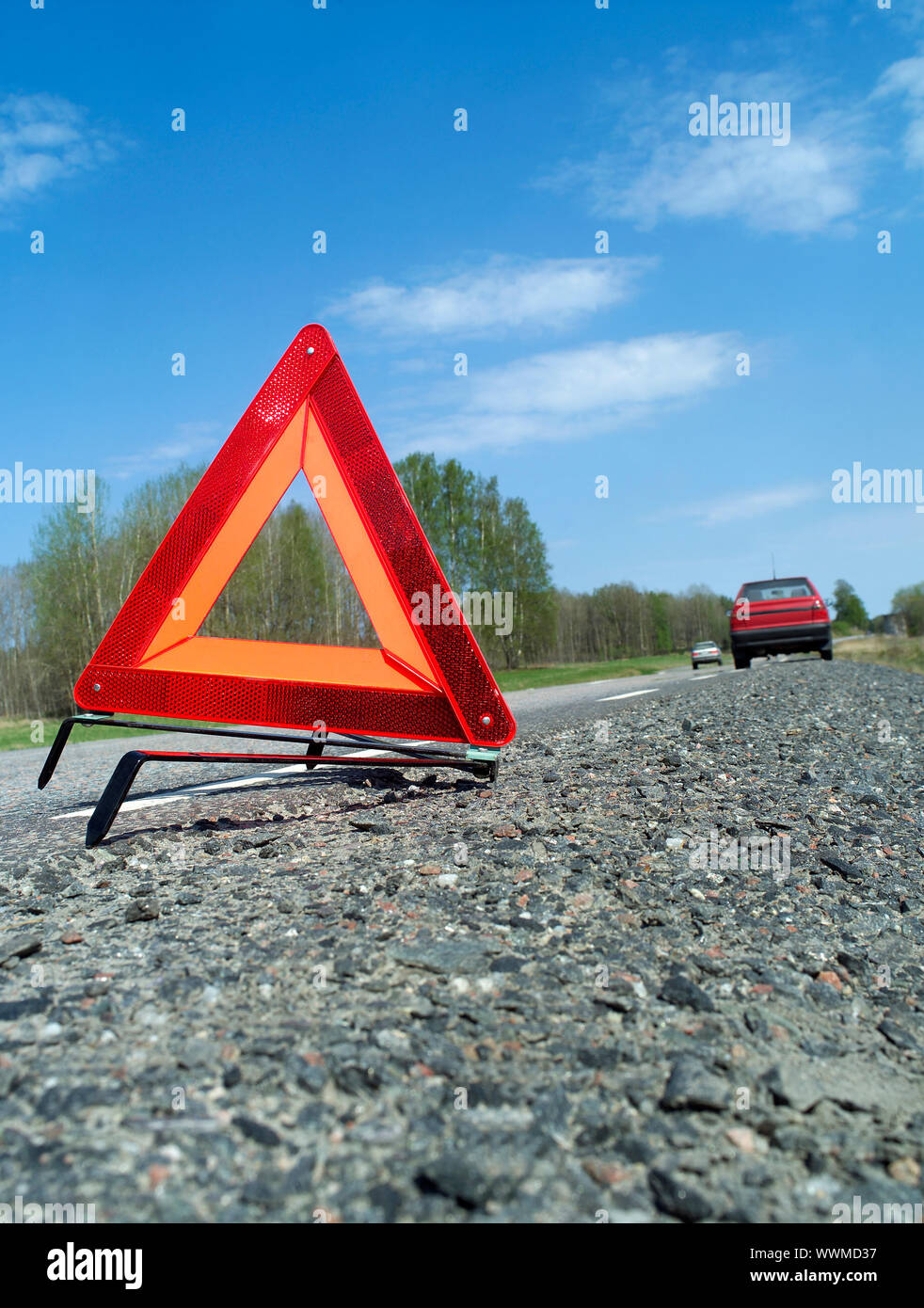 Warning traingle at the side of the road Stock Photo - Alamy
