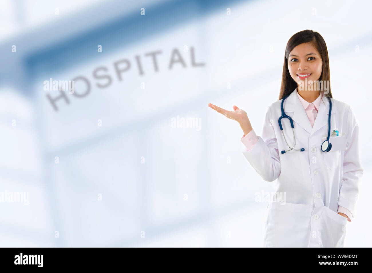 Young doctor hand gesturing welcome to hospital Stock Photo - Alamy