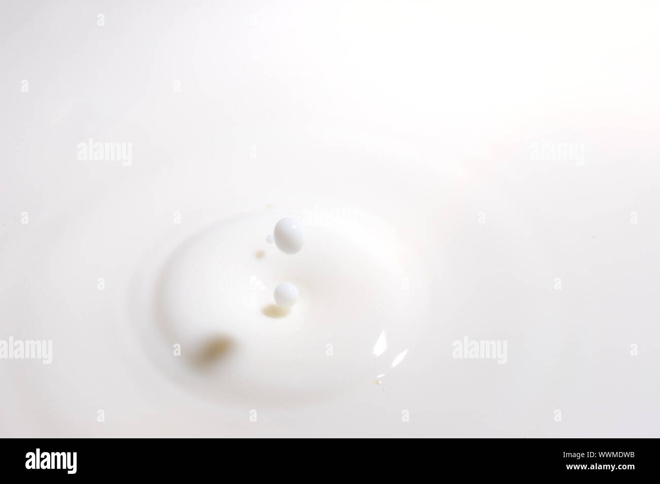 drop of milk splashes into fresh milk Stock Photo - Alamy