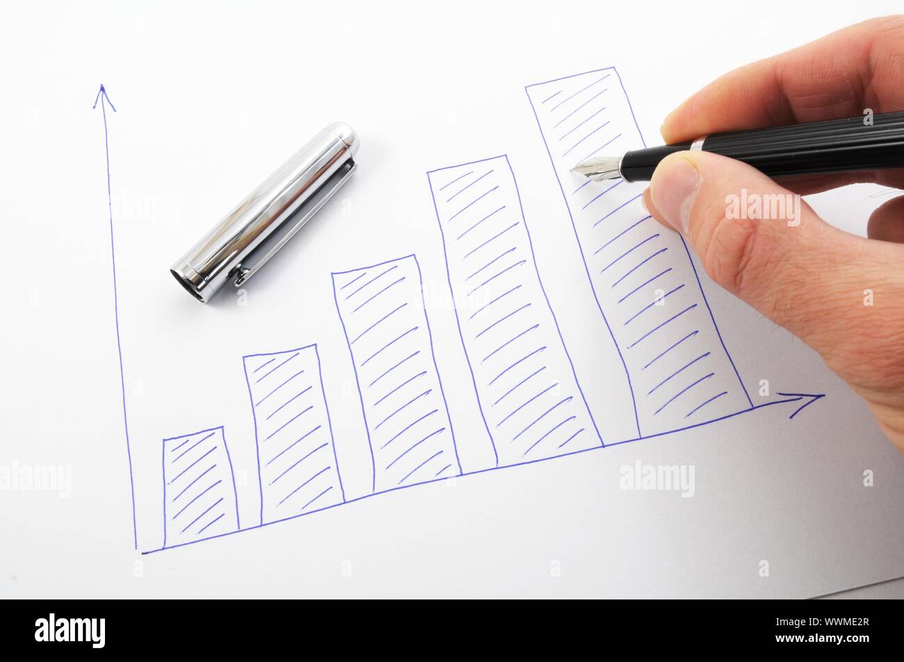 hand pen and paper with business chart illustration Stock Photo - Alamy