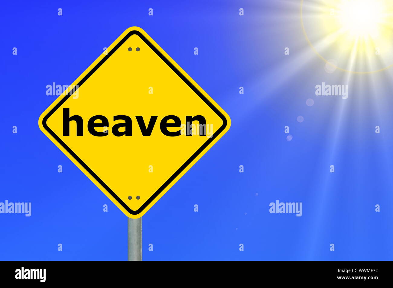good and heaven concept with yellow road sign Stock Photo - Alamy