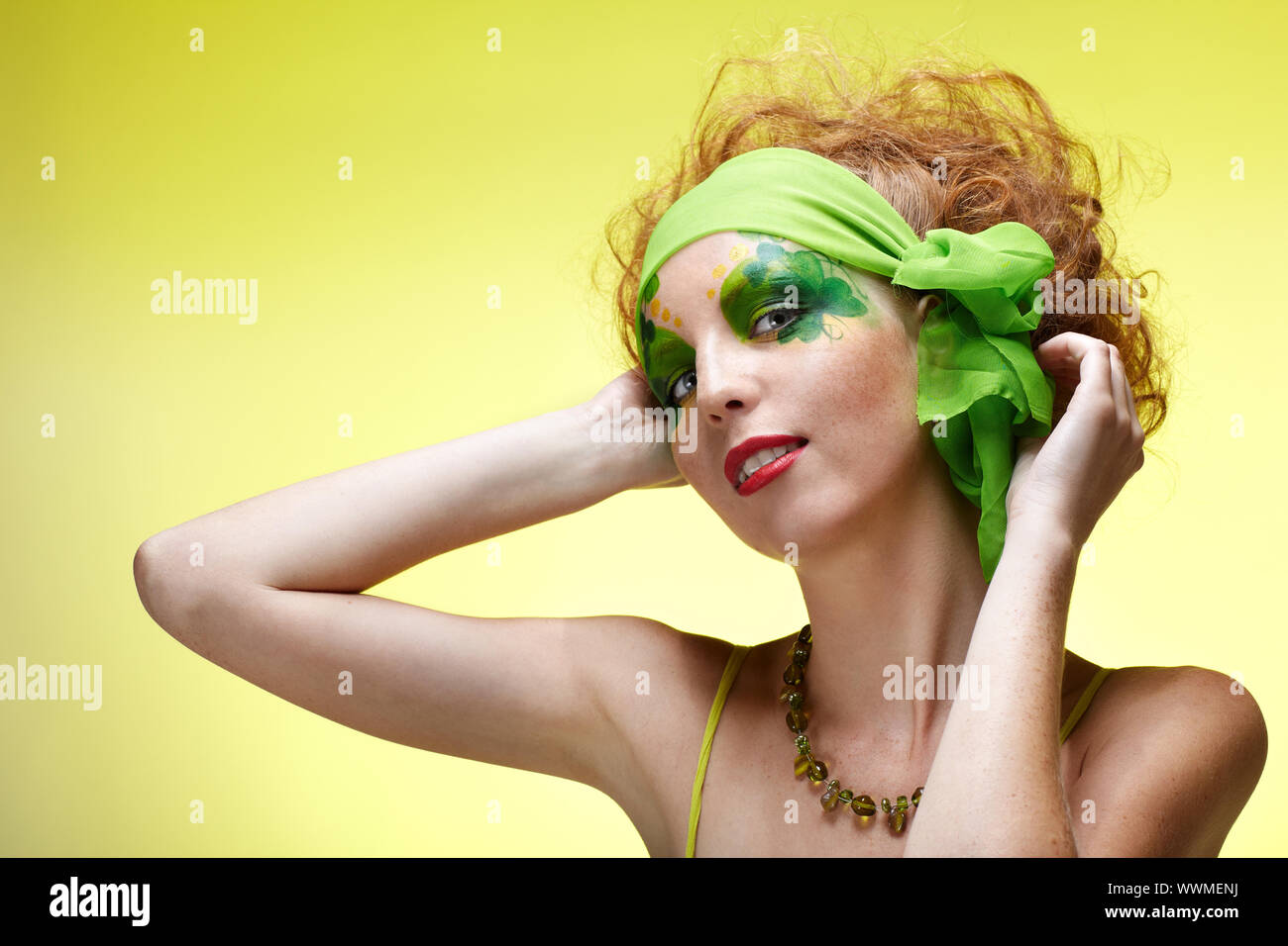 portrait of beautiful red-haired model with shamrock body art Stock ...