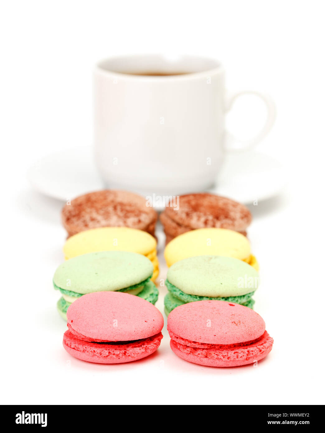 Colorful Macaroon and cup of coffee on white background Stock Photo - Alamy