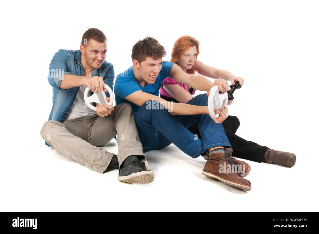 Three young friends ar gaming with the computer Stock Photo - Alamy