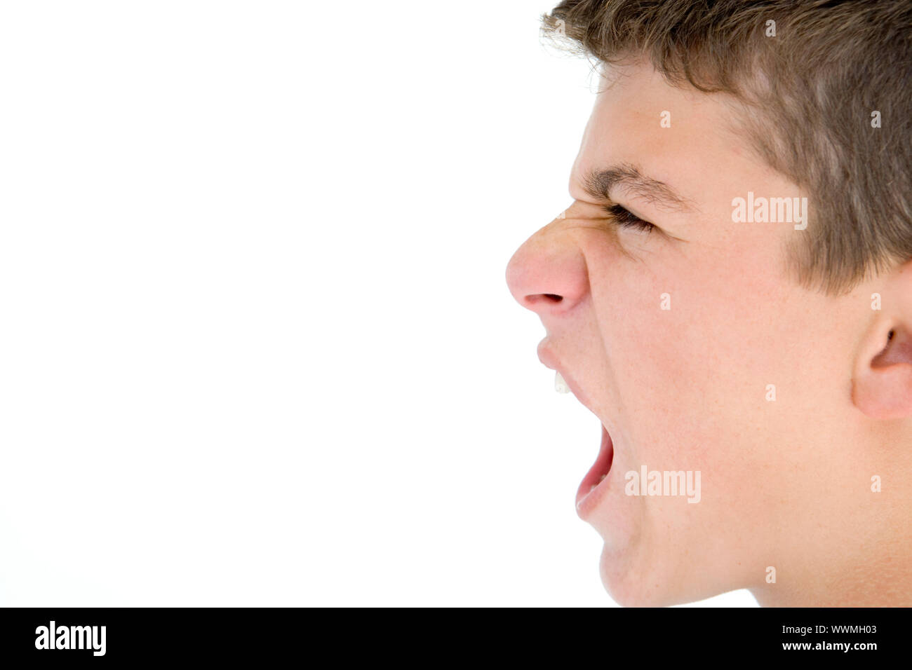 Teenage boy shouting Stock Photo - Alamy