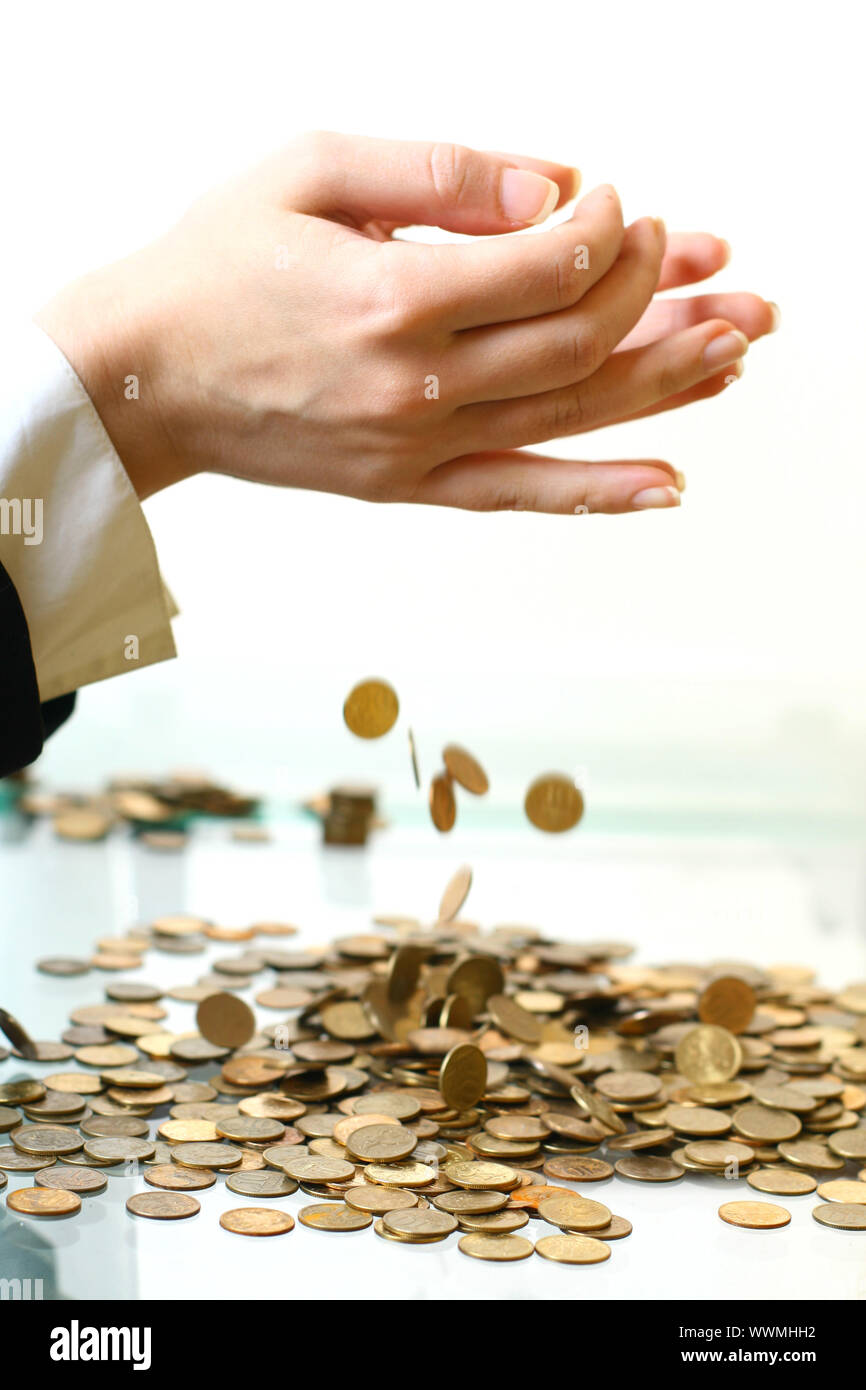 hand make coins rain on white Stock Photo - Alamy