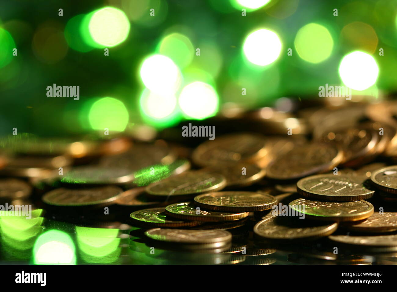 coins and colored bokeh on background Stock Photo - Alamy