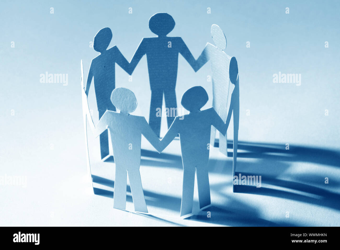 paper team linked together partnership concept Stock Photo - Alamy