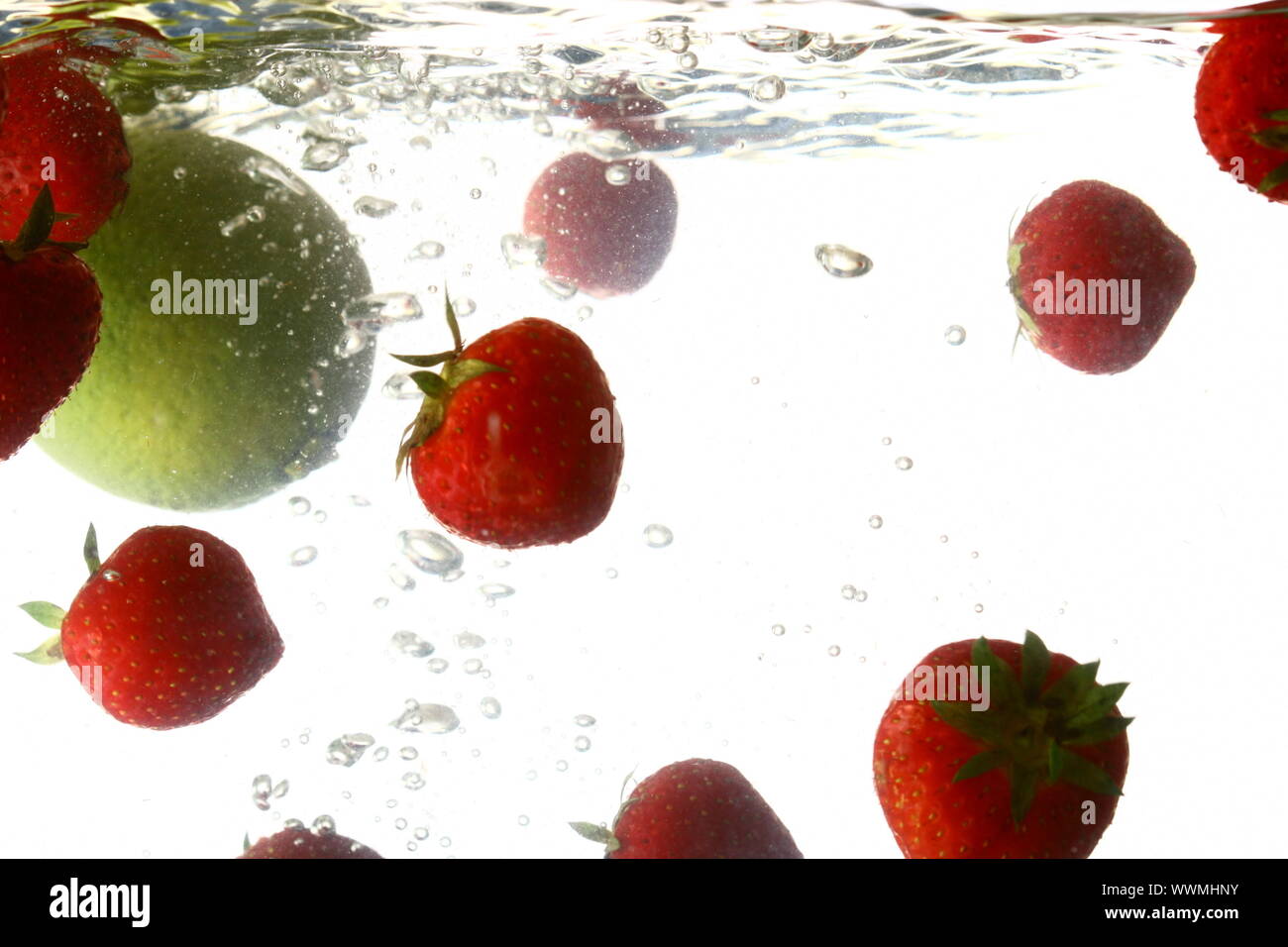 lime splash isolated on white background Stock Photo - Alamy