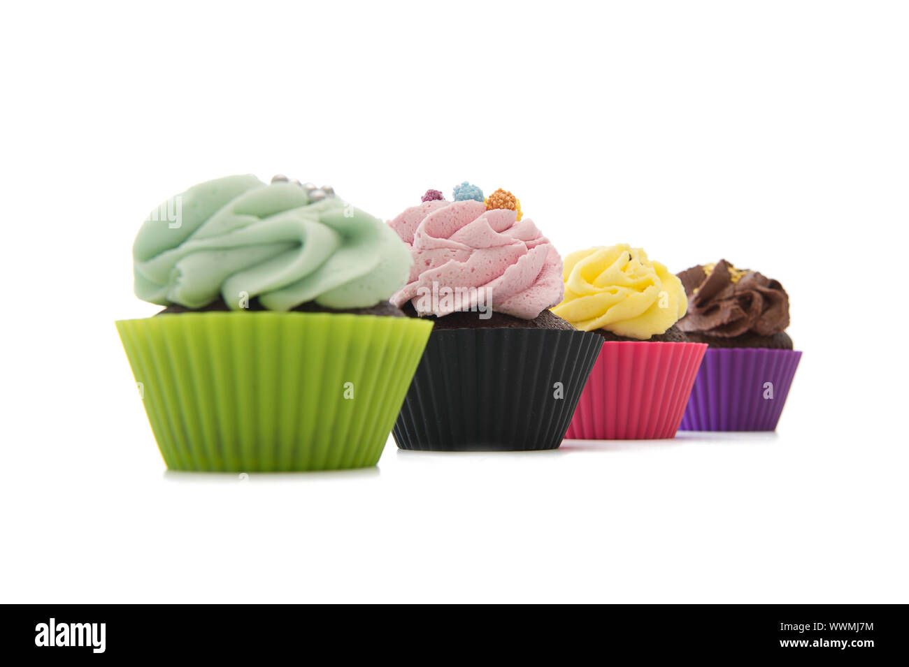 Cupcakes in line over white. Focus on one Stock Photo - Alamy