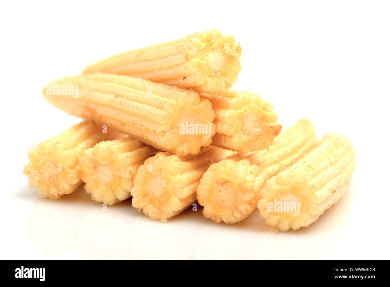 Mini Sweetcorn closeup on white background Stock Photo - Alamy