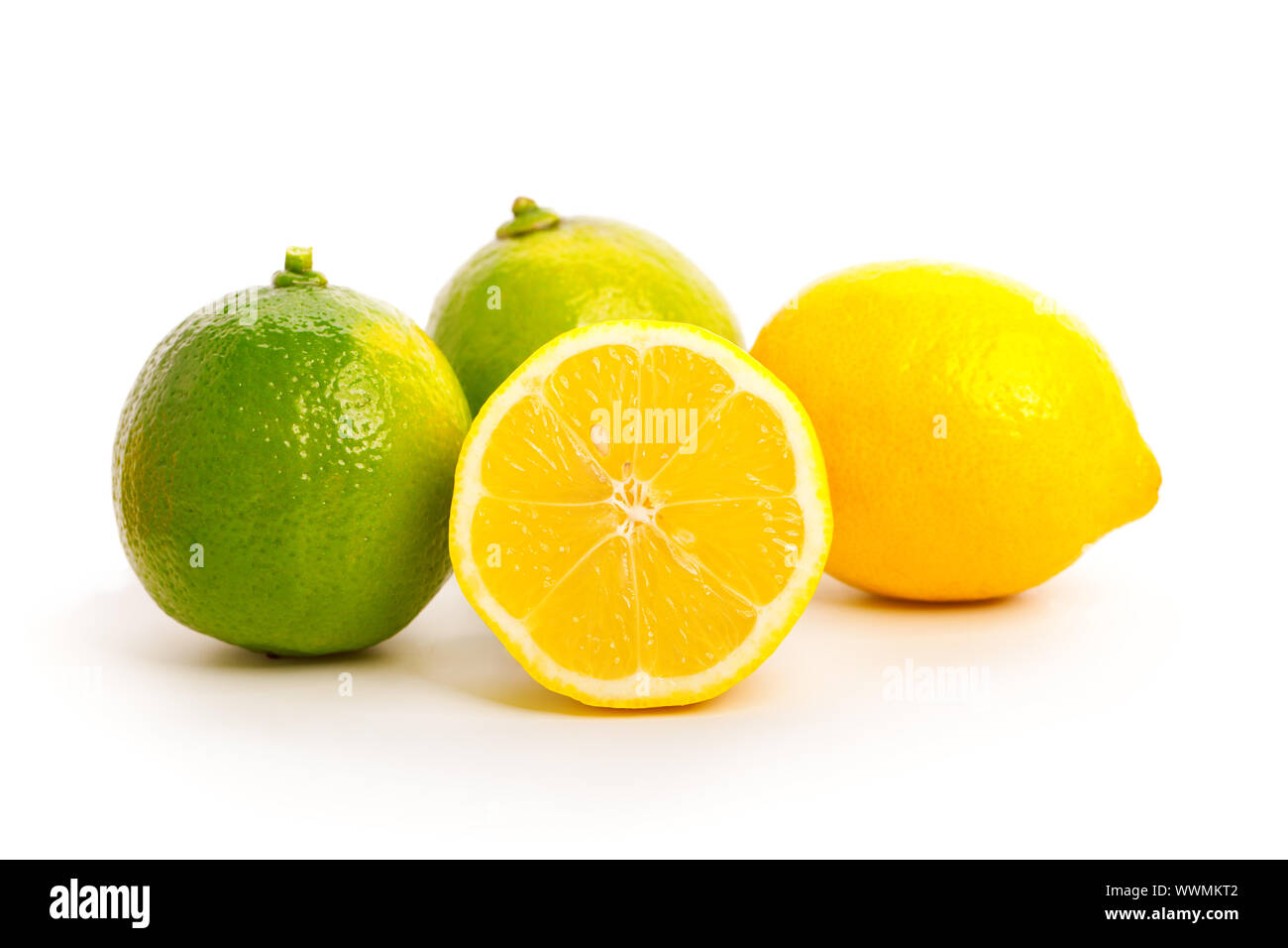 yellow and green lemon over white background Stock Photo - Alamy
