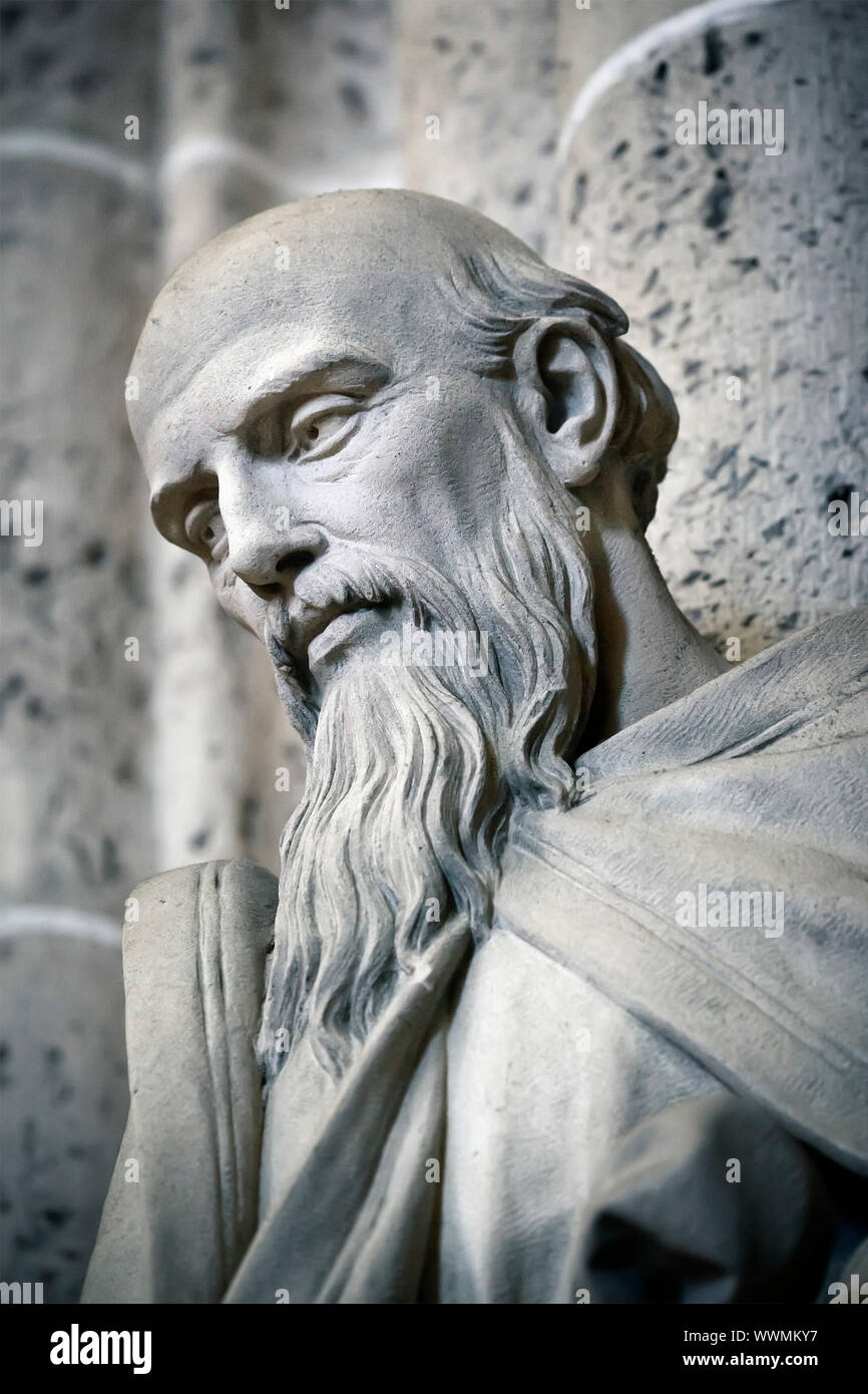 An image of a male face in stone Stock Photo - Alamy