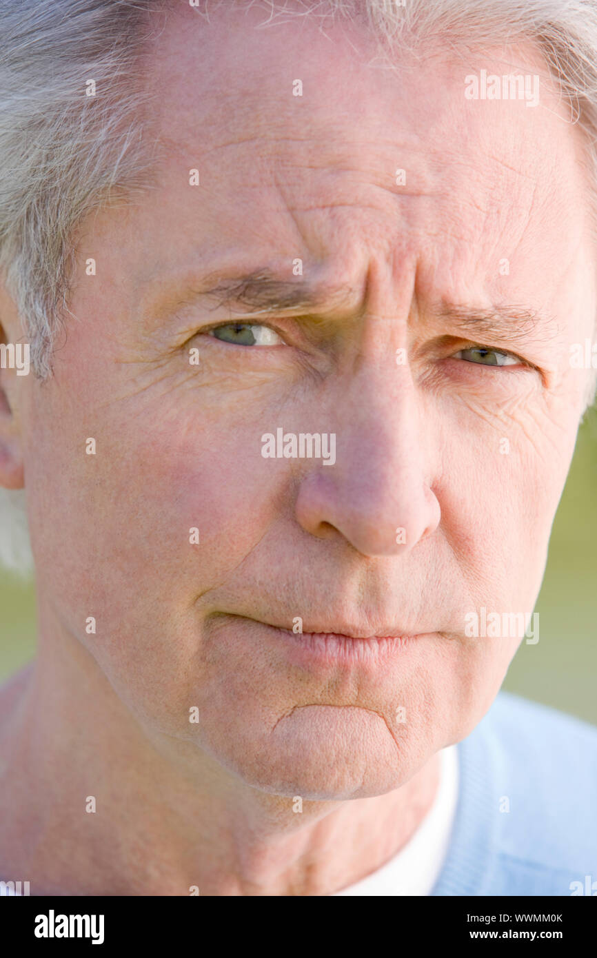 Head shot of man thinking Stock Photo - Alamy