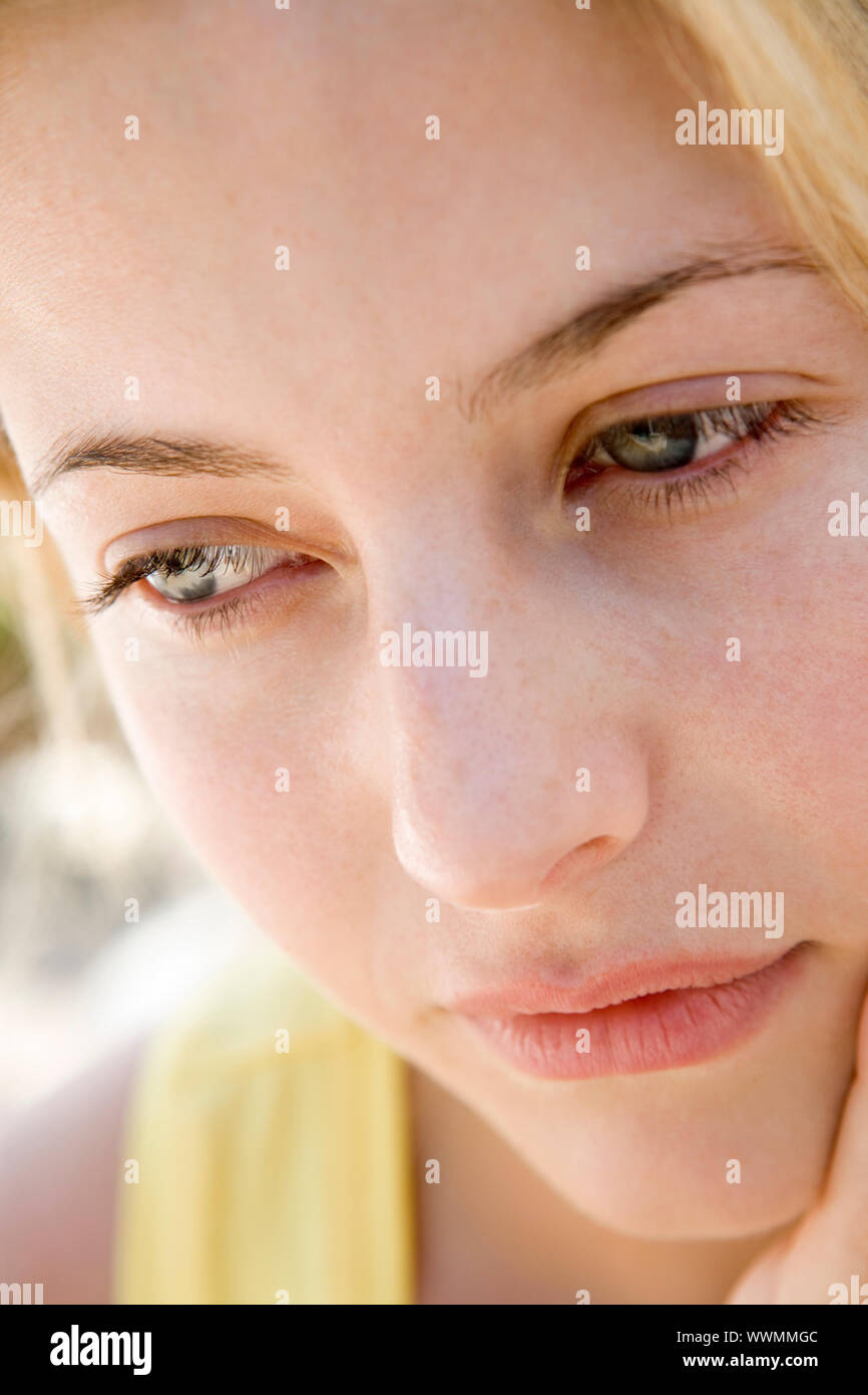 Head shot of woman thinking Stock Photo - Alamy