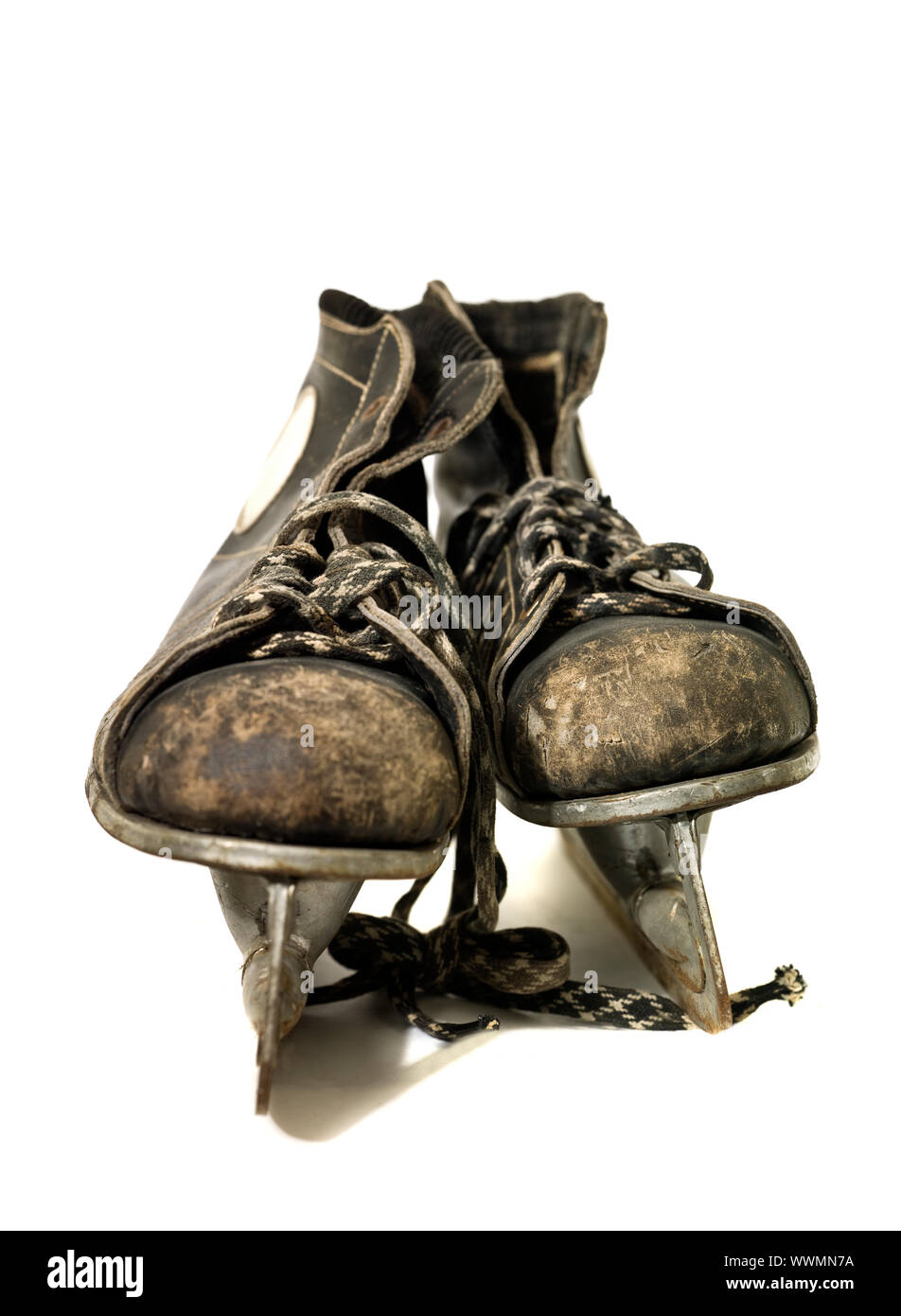 Worn ice-skates isolated on white background Stock Photo - Alamy