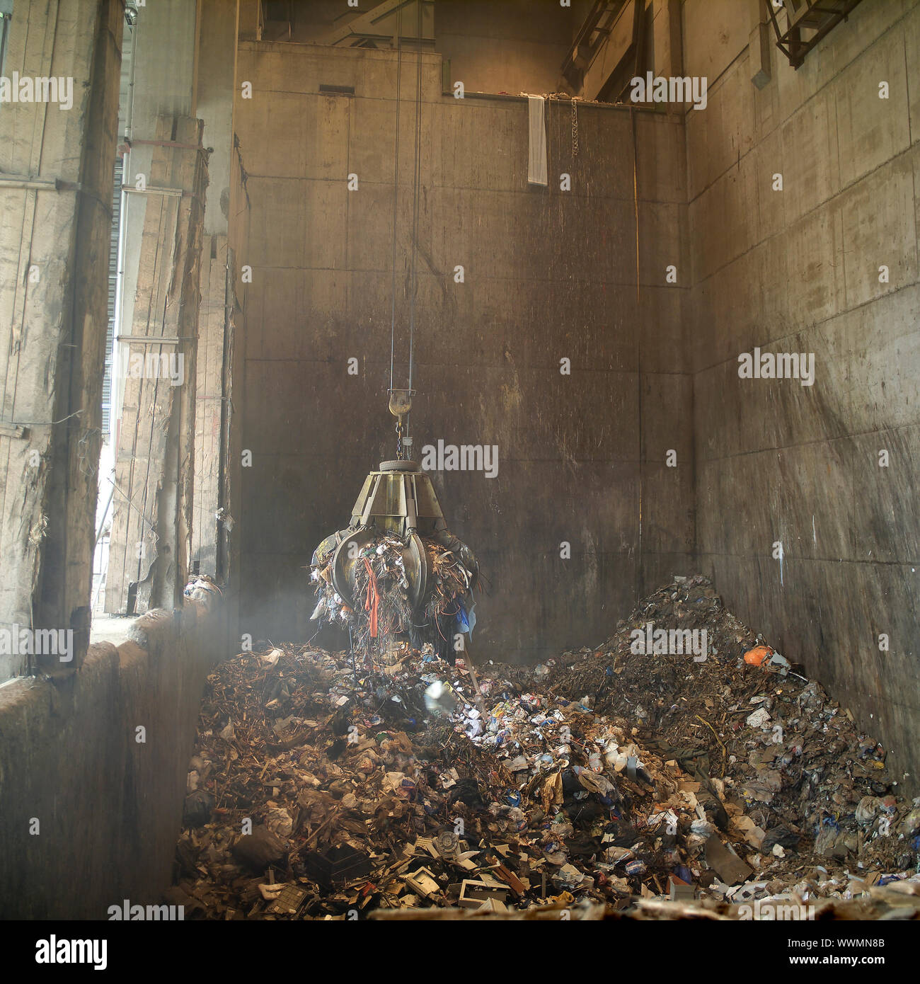 Industrial claw with Garbage Dump Stock Photo - Alamy