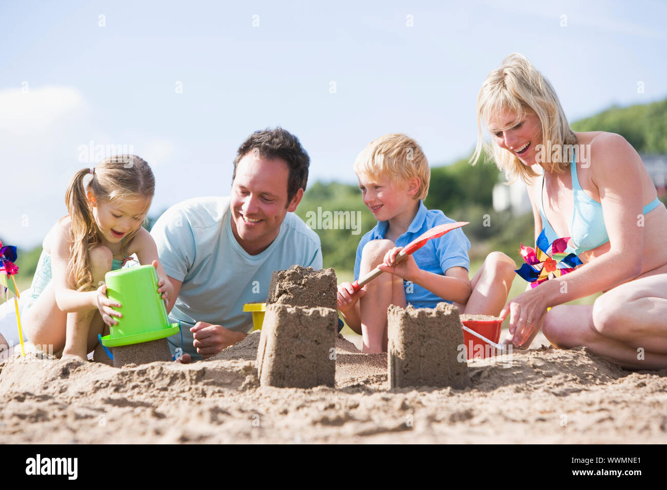 Family on beach making hi-res stock photography and images - Alamy