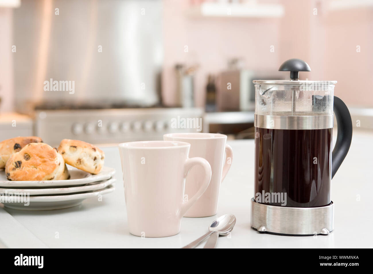 Coffee pot on kitchen counter with scones Stock Photo - Alamy
