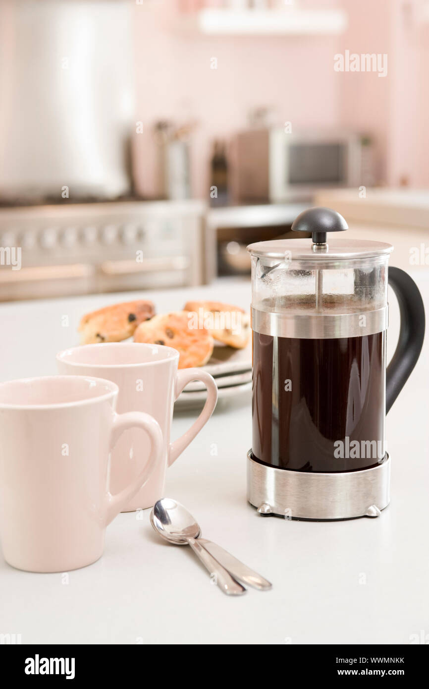 Coffee pot on kitchen counter with scones Stock Photo - Alamy