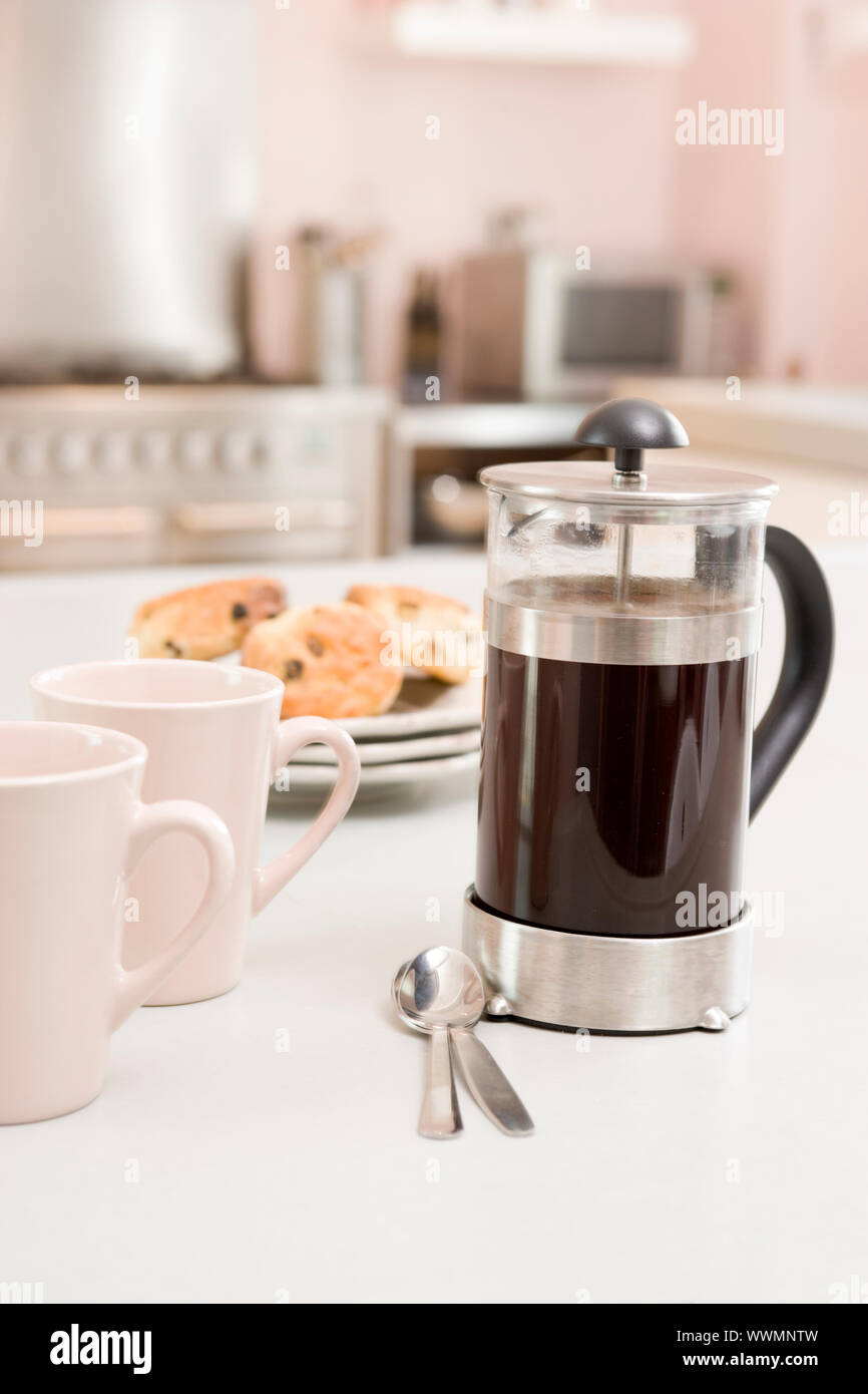 Coffee pot on kitchen counter with scones Stock Photo - Alamy