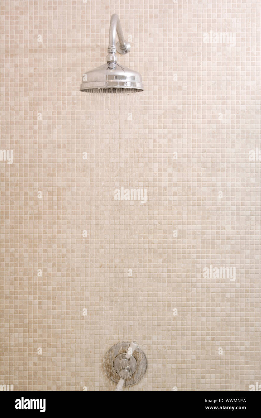 Empty shower with running water Stock Photo - Alamy