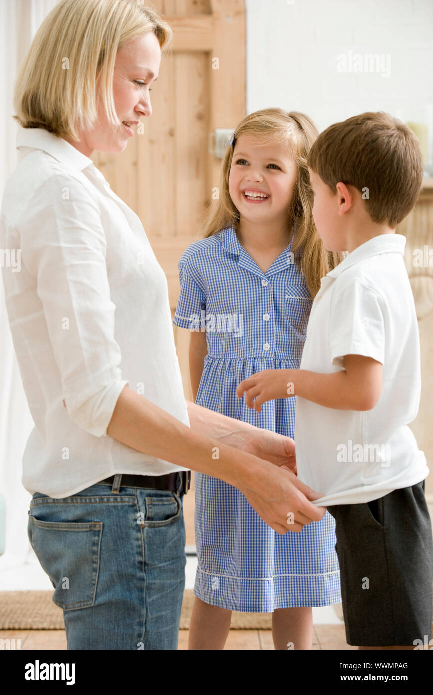 Boy Getting Dressed For School