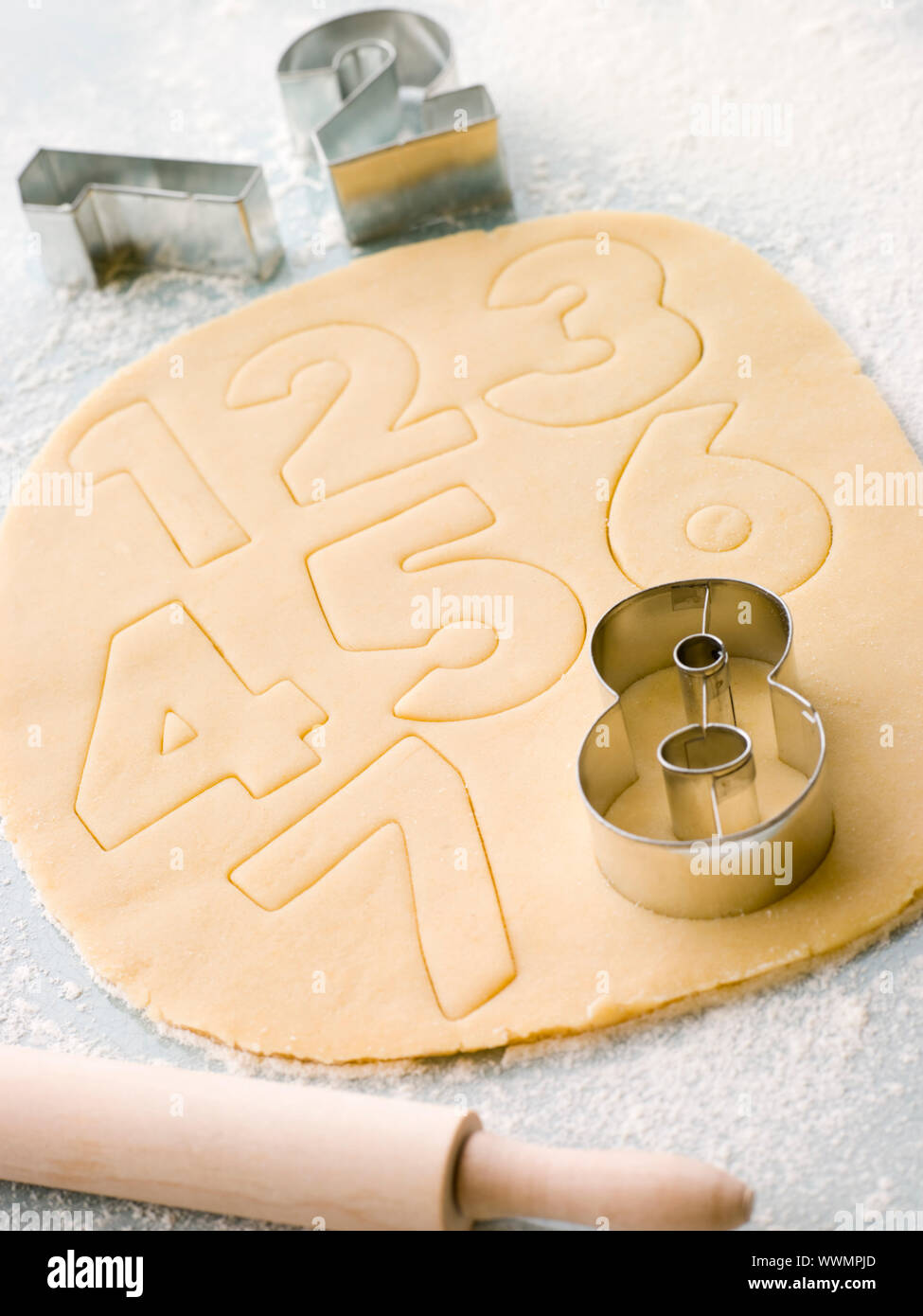 Cutting out Number Shape Biscuits Stock Photo - Alamy