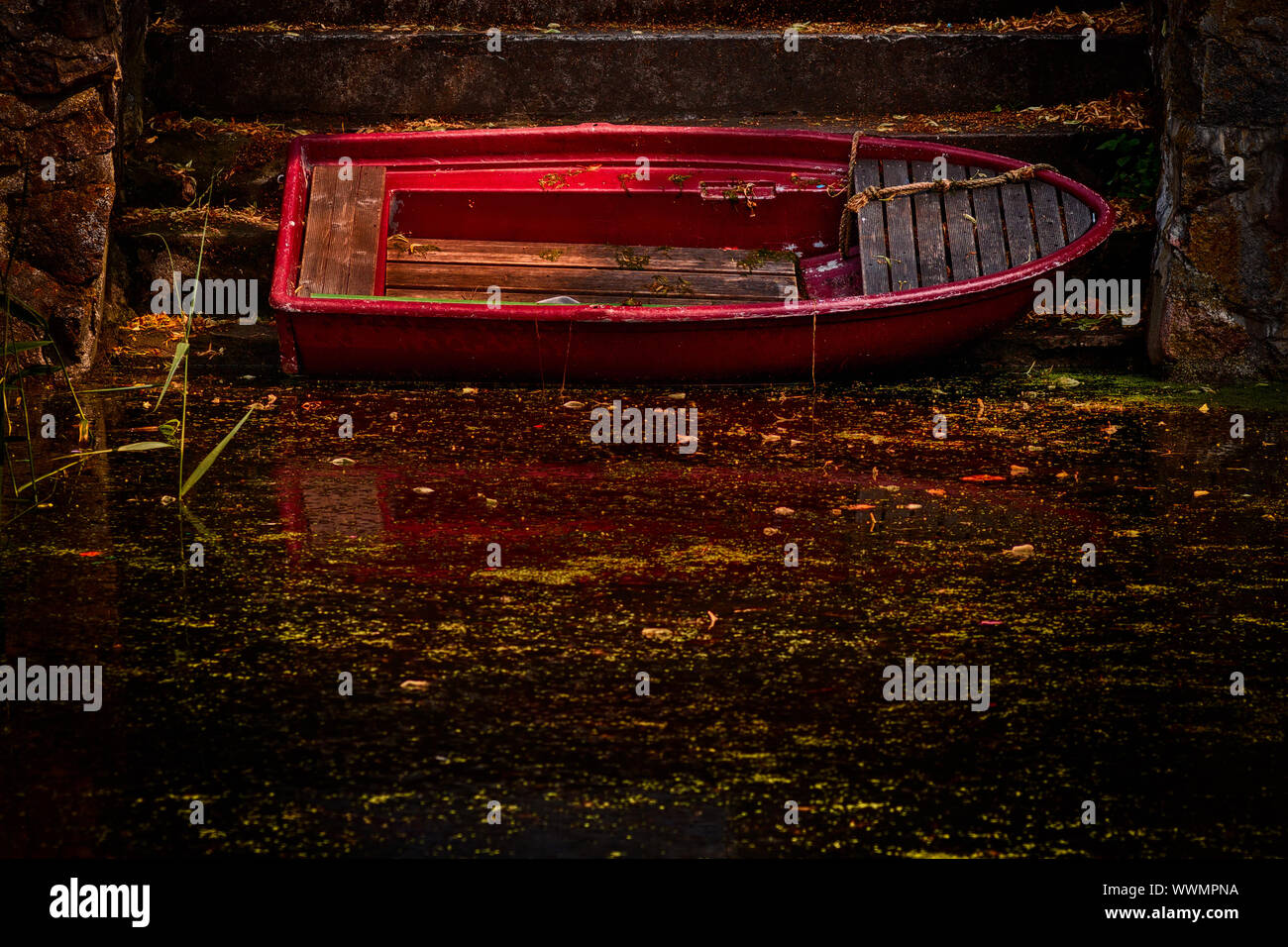 old red rowing boat with light mood Stock Photo - Alamy